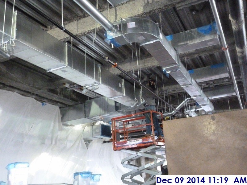 Installing pipe hangers at the 1st floor Facing West